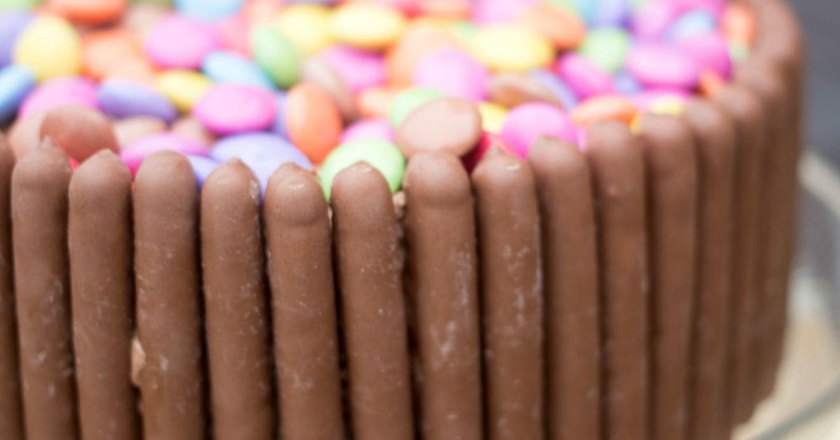 Simple Kids Birthday Cake with Choc Fingers and Smarties – Easy Recipe